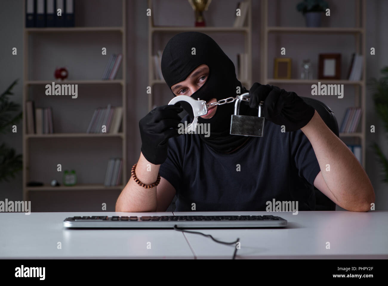 Hacker hacking computer late at night Stock Photo - Alamy