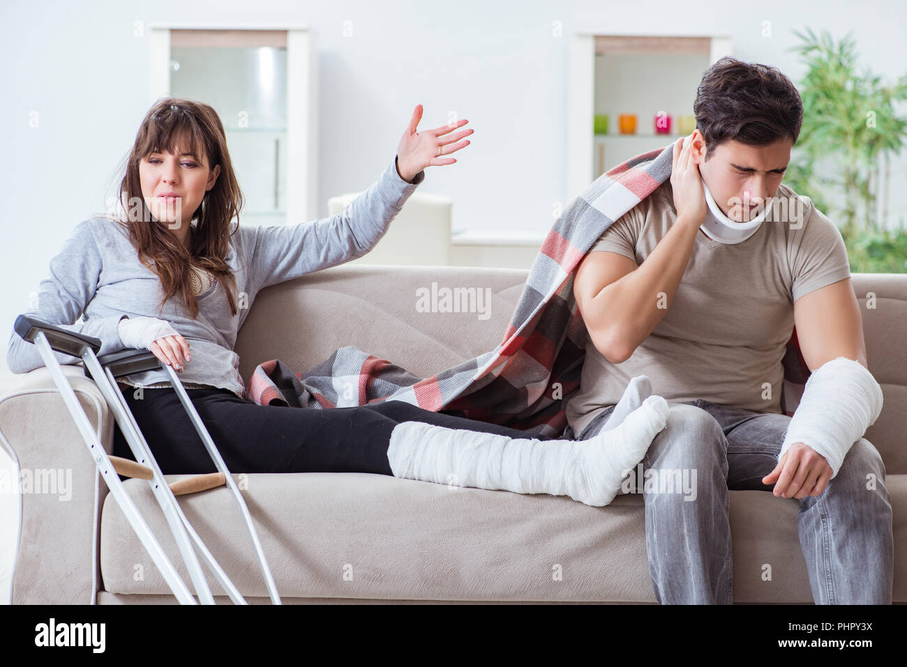 Injured family of wife and husband recovering at home Stock Photo - Alamy