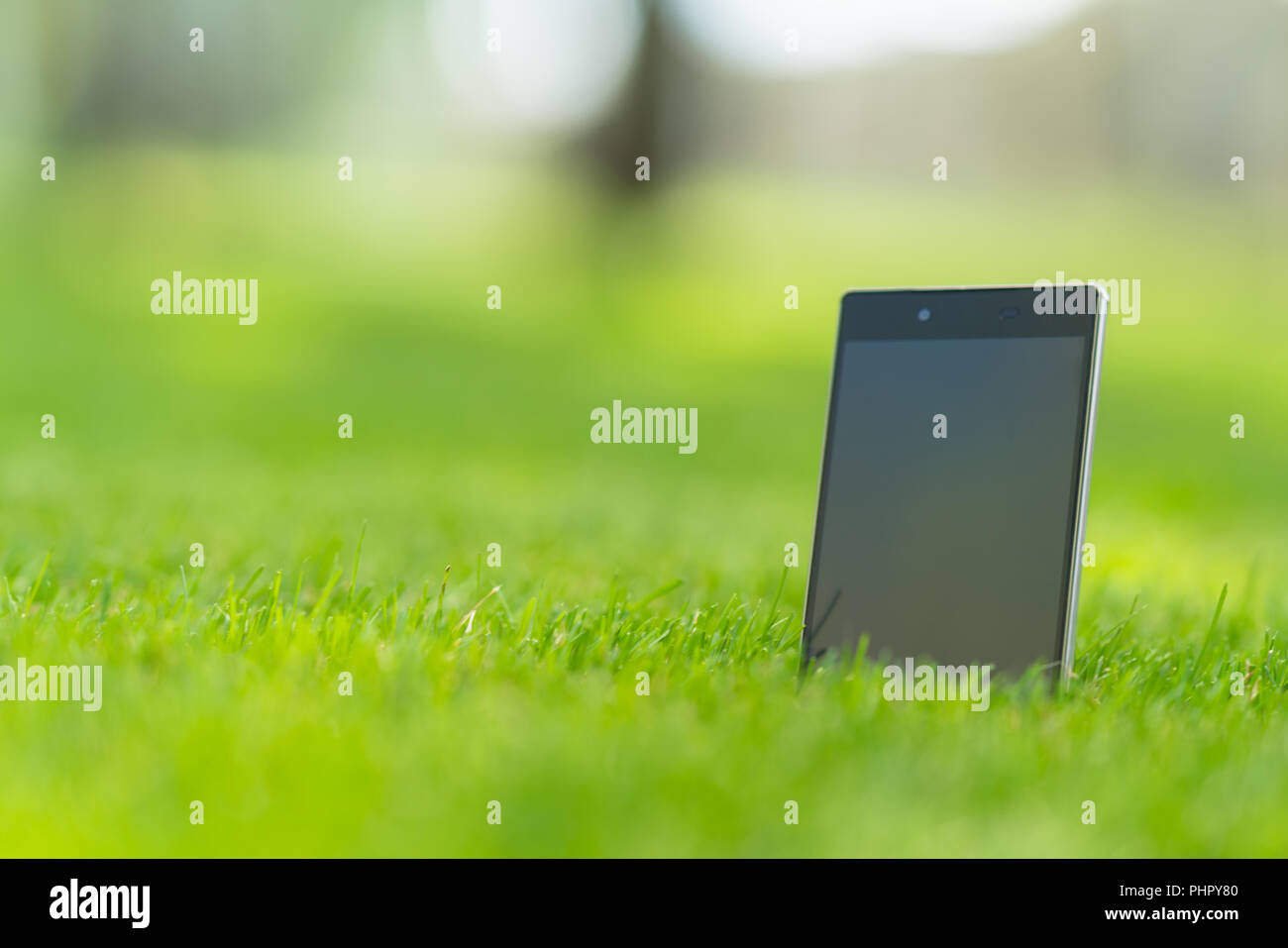 Blank tablet pc with a black screen with copy space standing upright in ...