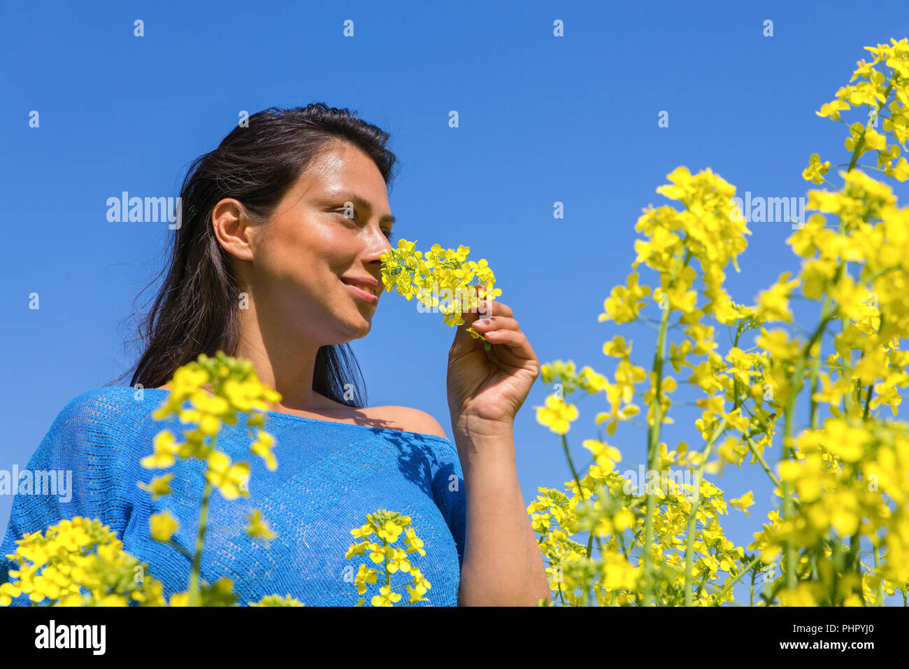 Woman smelling flower hi-res stock photography and images - Alamy