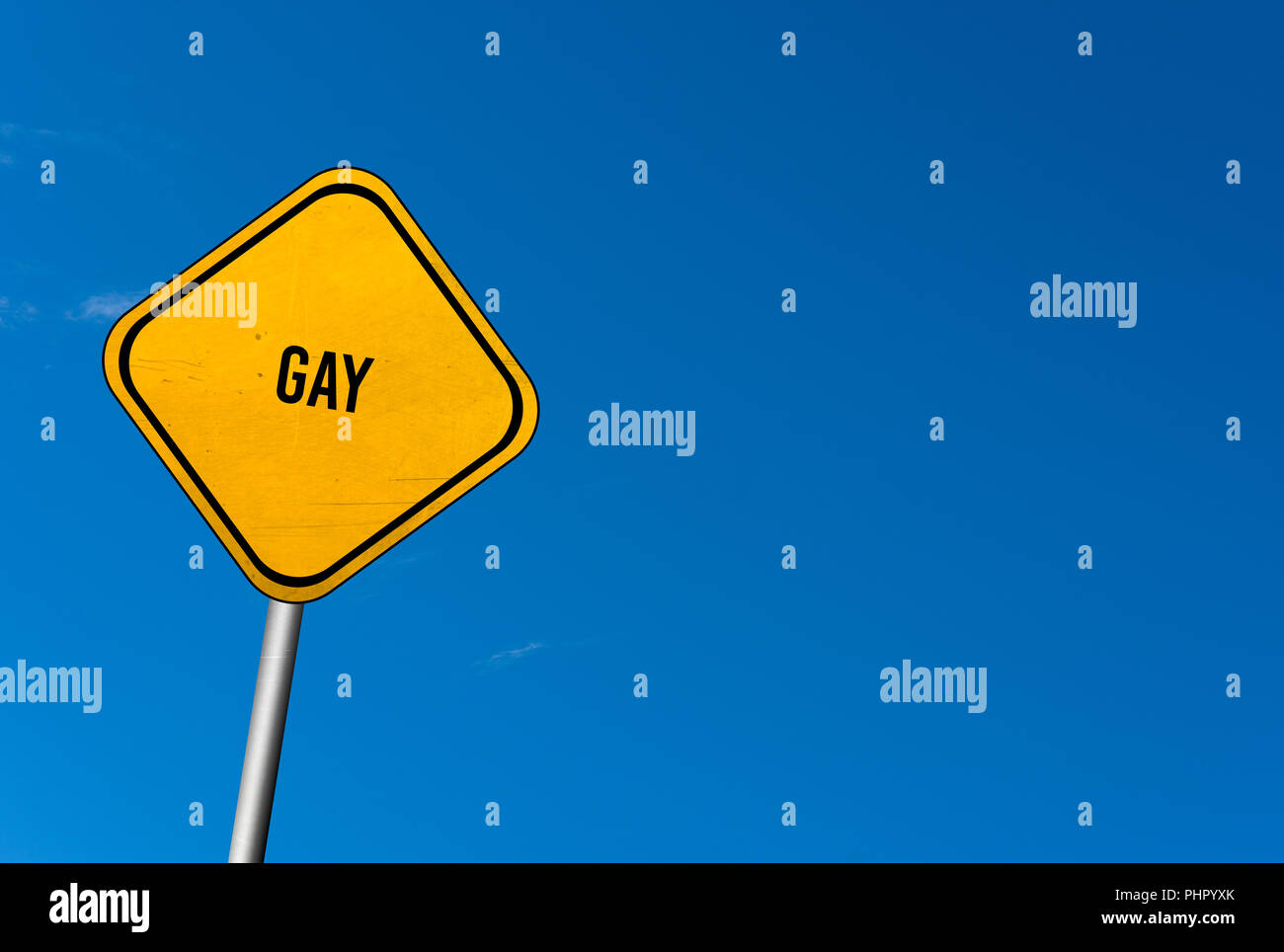 gay - yellow sign with blue sky Stock Photo - Alamy