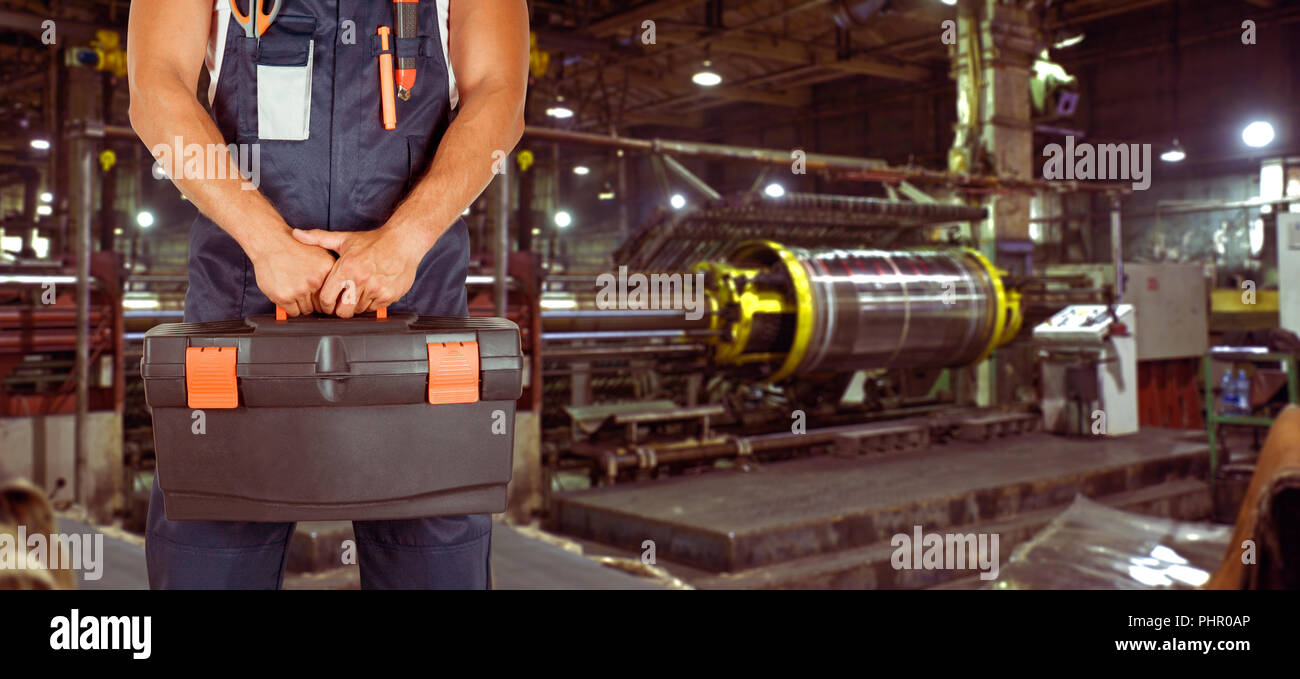 Worker with instruments Stock Photo - Alamy