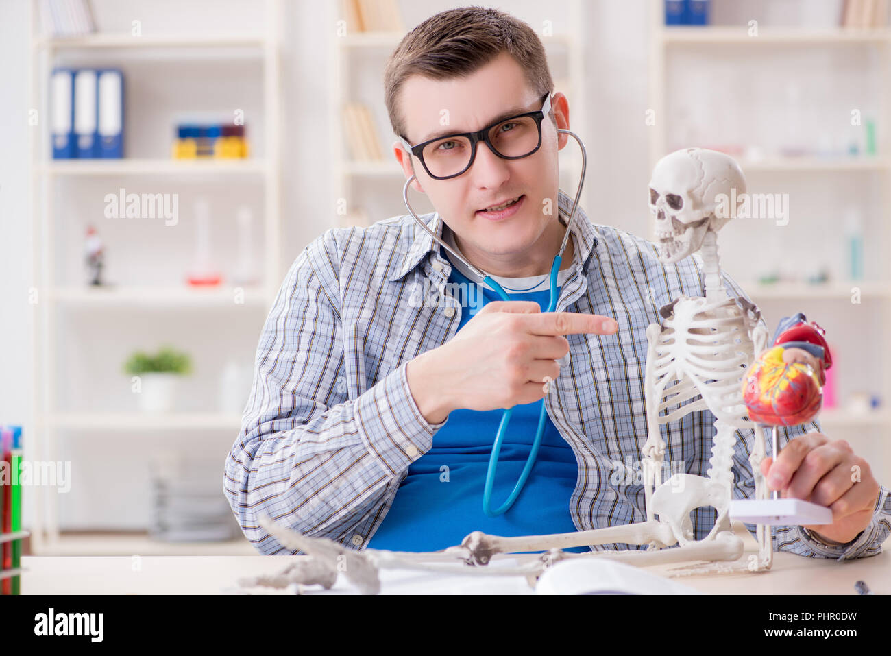 Medical student studying skeleton in classroom during lecture Stock ...