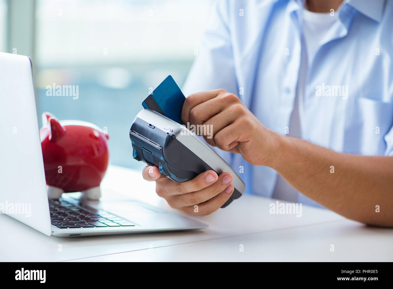 Man processing credit card transaction with POS terminal Stock Photo ...
