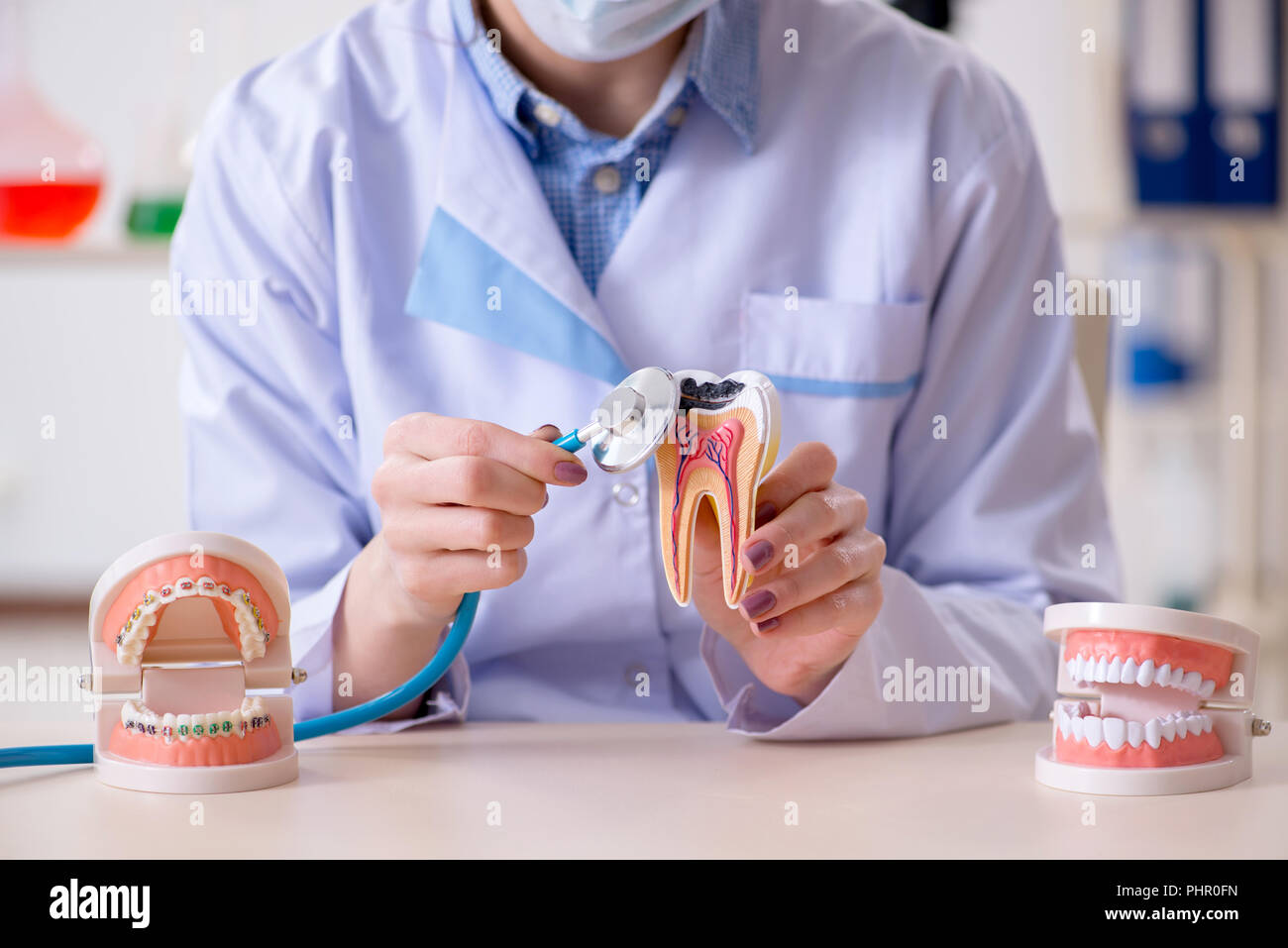 Dentist practicing work on tooth model Stock Photo - Alamy