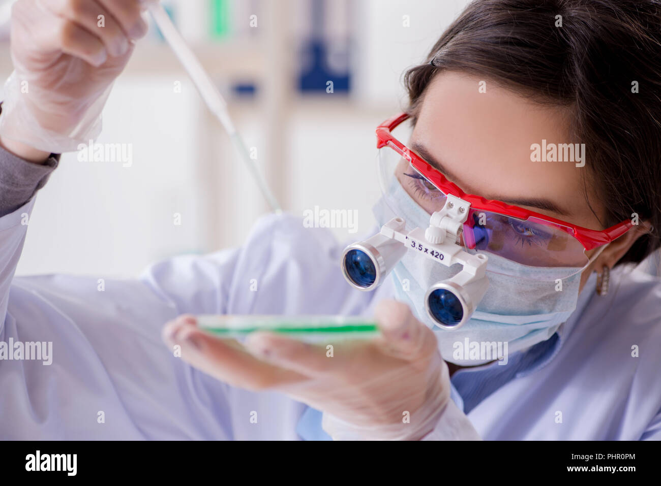 Lab assistant in drug synthesis concept Stock Photo - Alamy