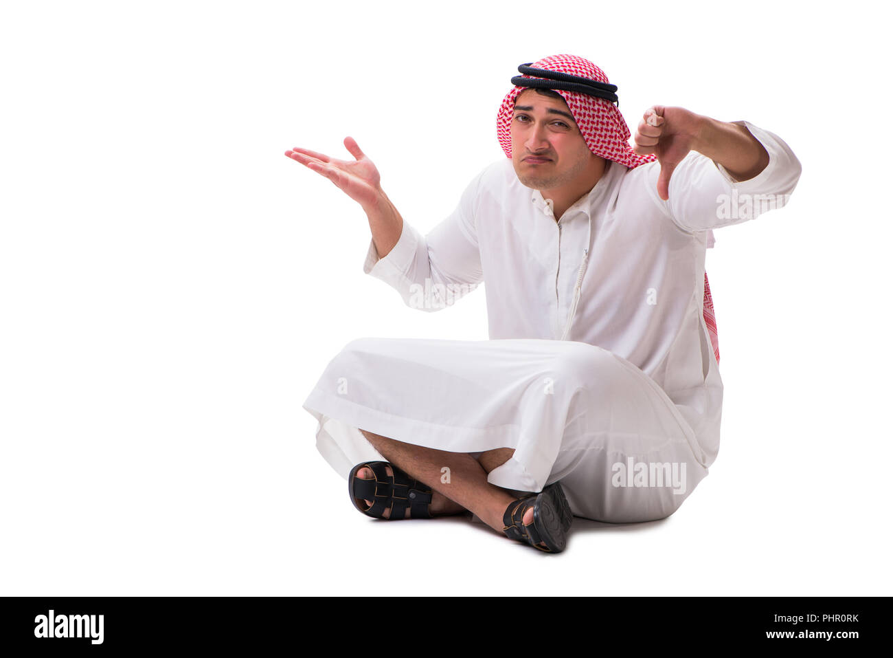 Young arab man sitting isolated on white Stock Photo - Alamy