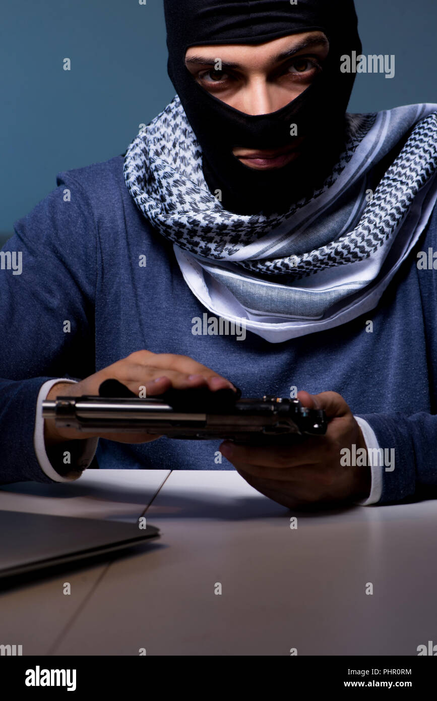 Terrorist burglar with gun asking for money ransom Stock Photo - Alamy