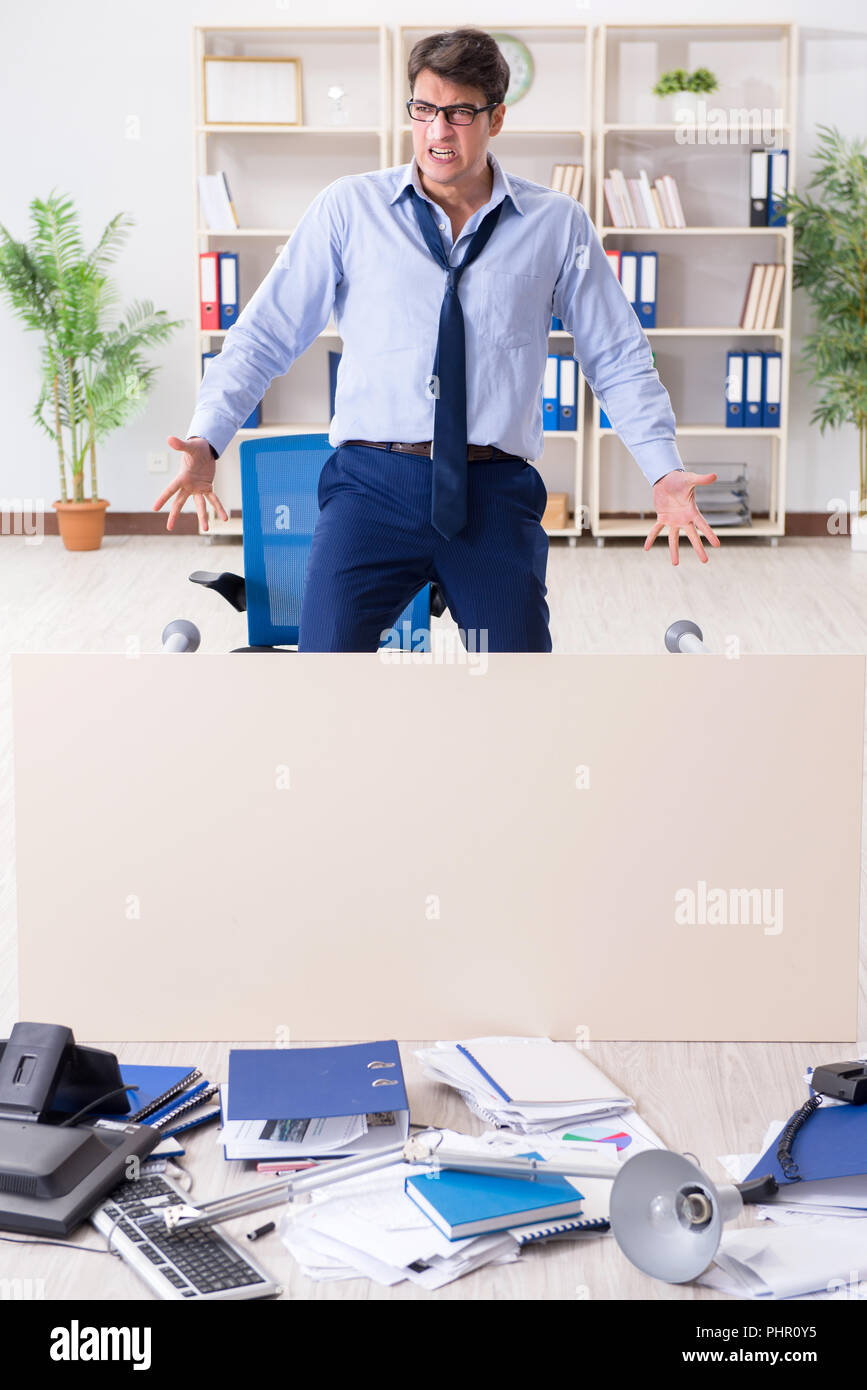 Angry businessman frustrated with too much work Stock Photo - Alamy