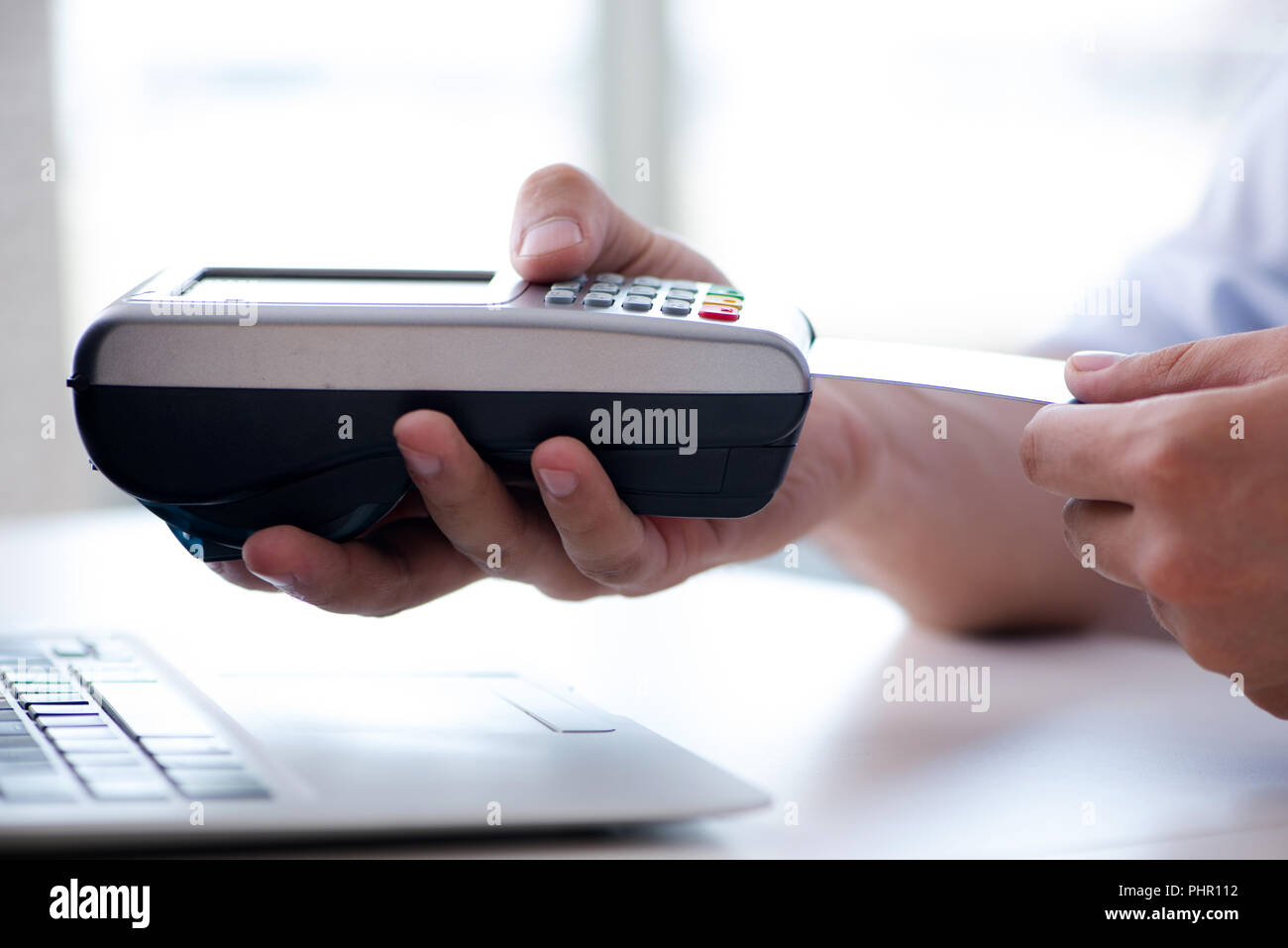 Man processing credit card transaction with POS terminal Stock Photo ...