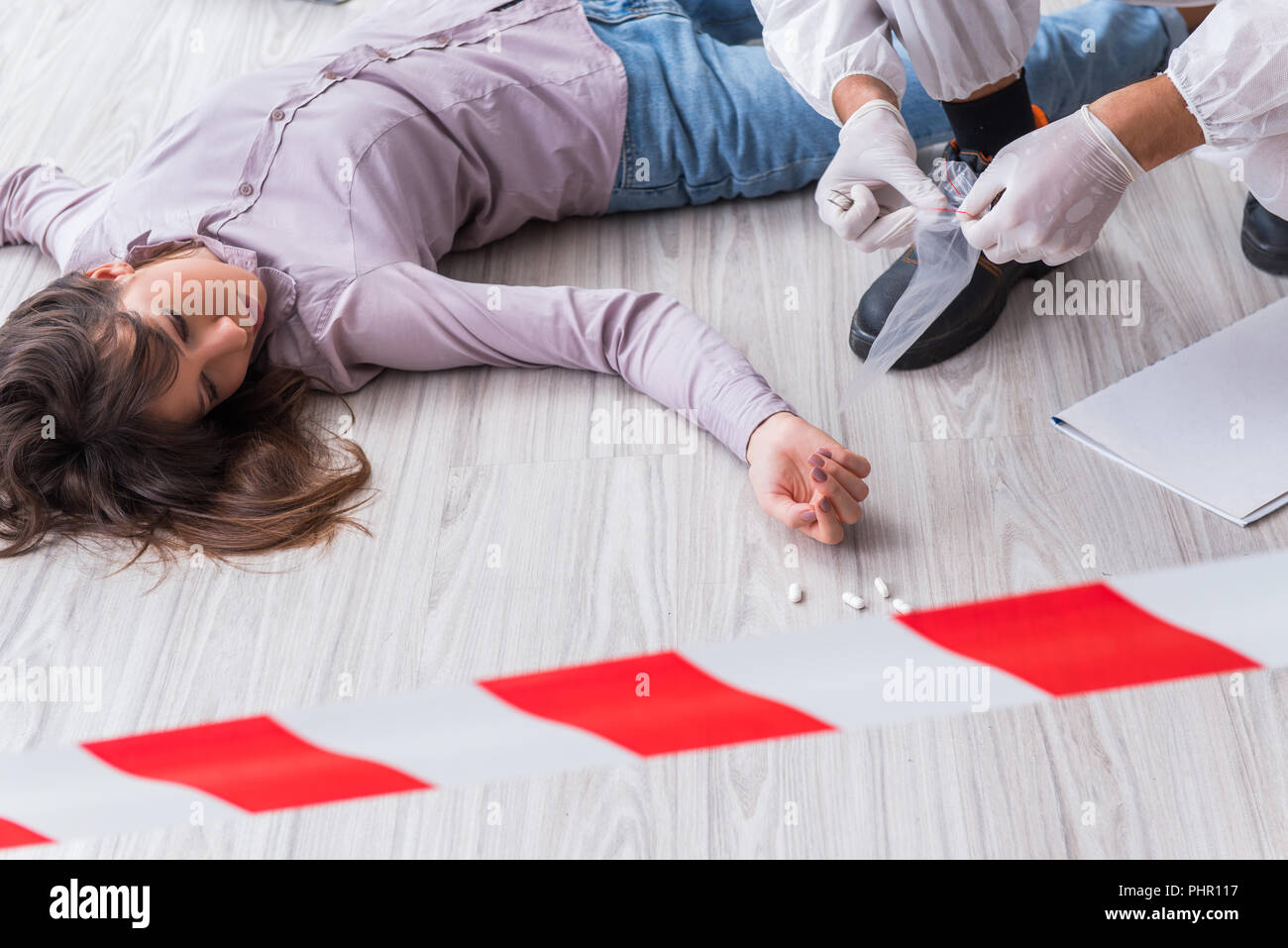 Forensic Investigator At The Crime Scene Investigating Woman Mur Stock