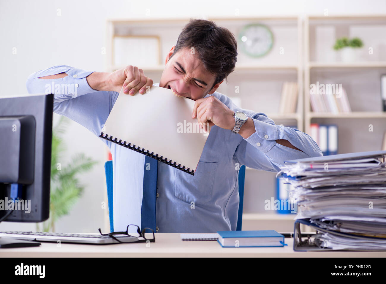 Tired businessman with too much paperwork Stock Photo - Alamy