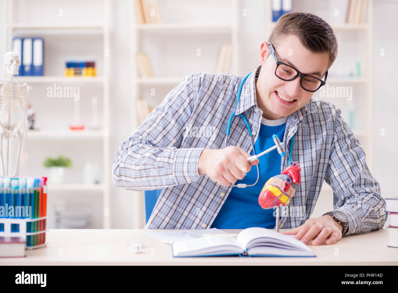 Medical student studying heart in classroom during lecture Stock Photo ...