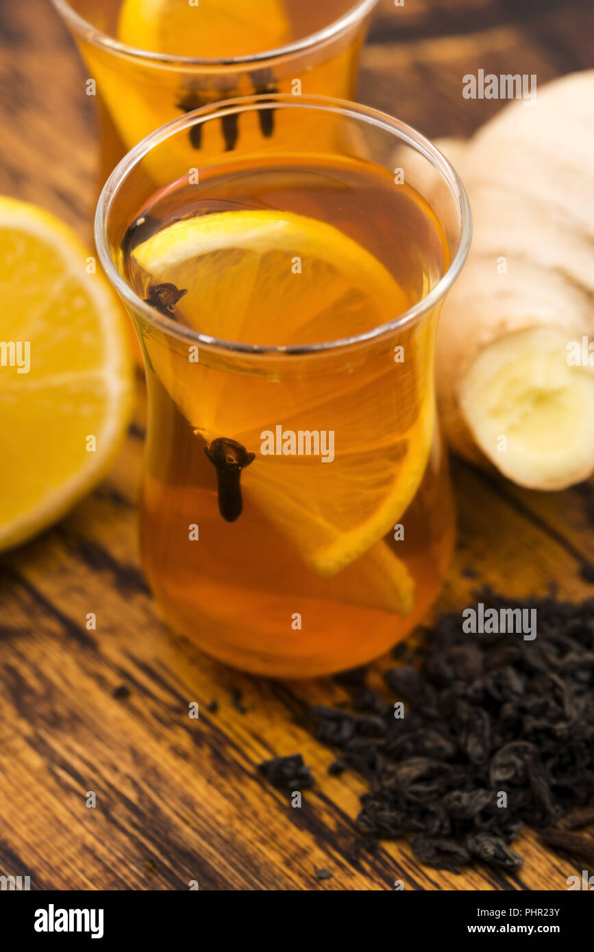 Black tea with lemon and ginger Stock Photo - Alamy