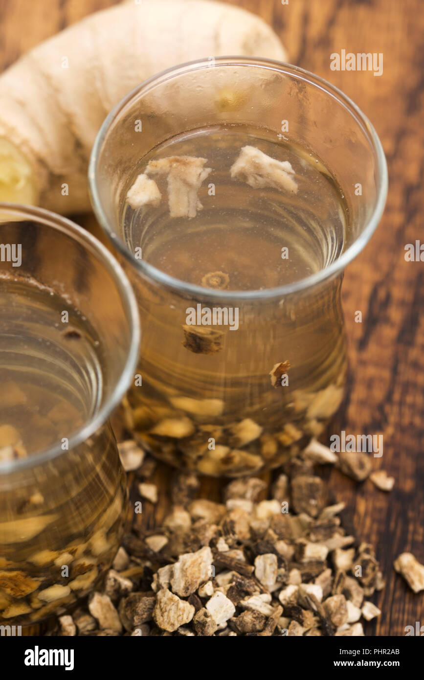 Teaglass with yellowhead root tea Stock Photo - Alamy