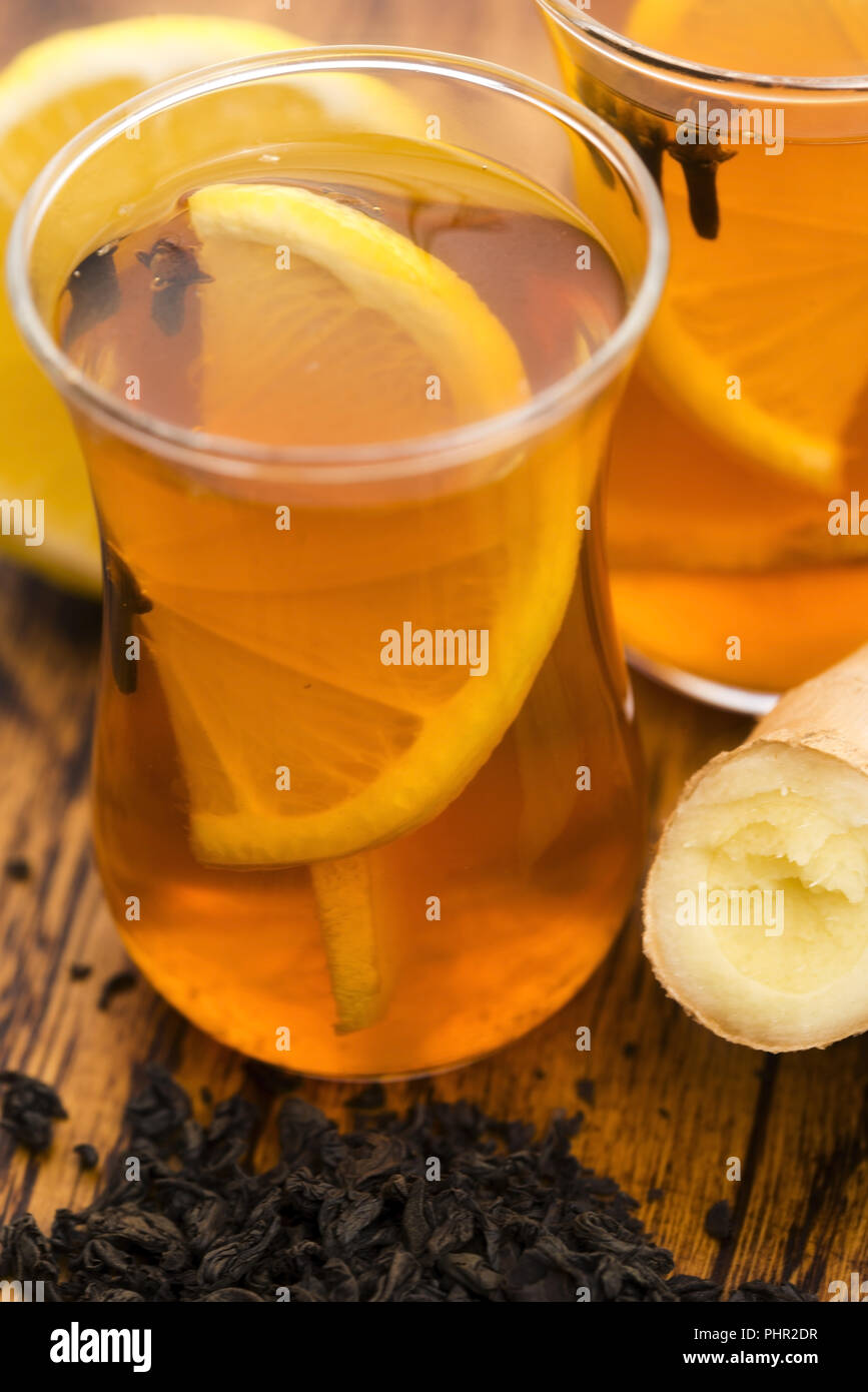 Black tea with lemon and ginger Stock Photo - Alamy