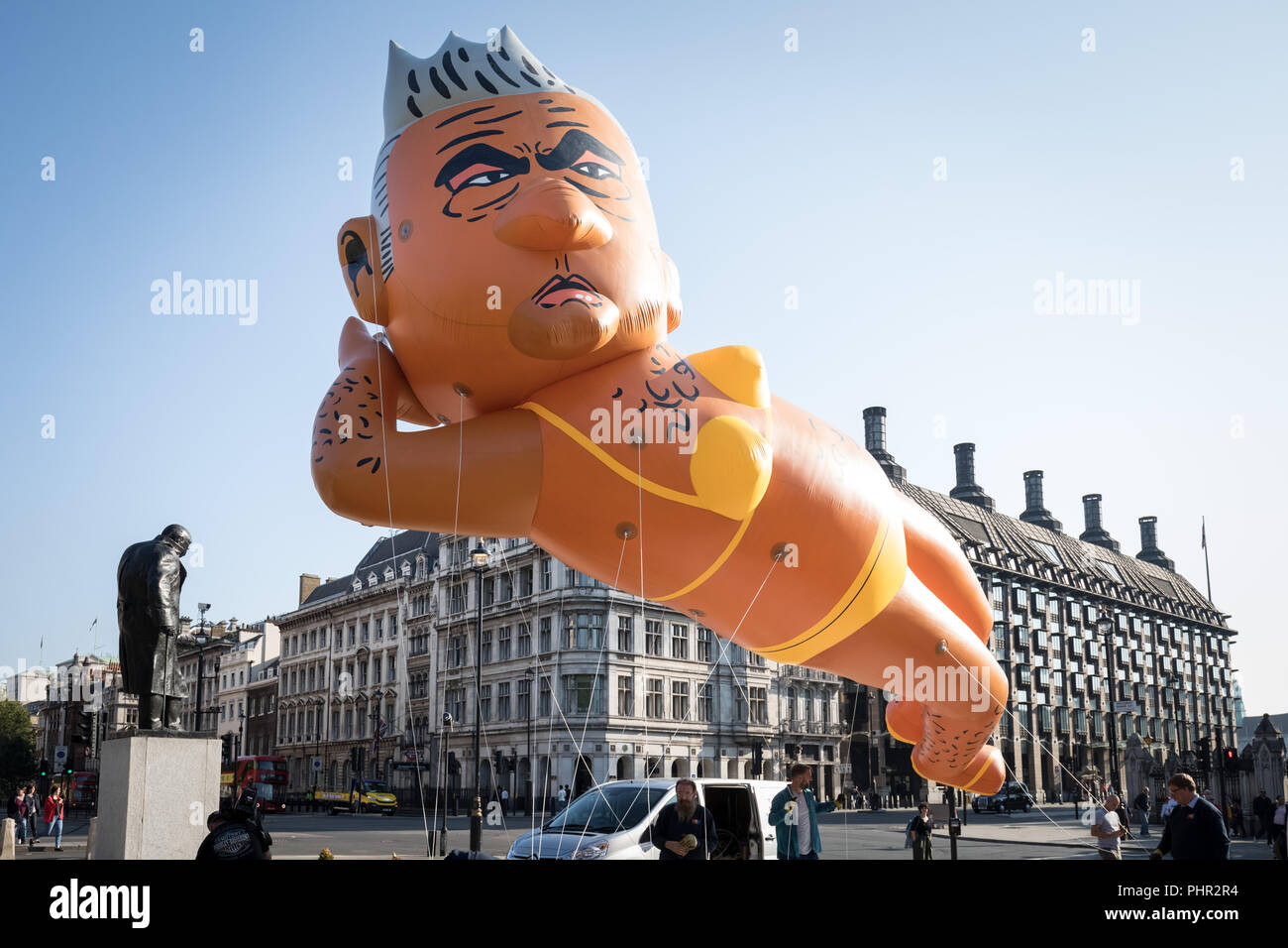 Giant blimp of London Mayor Sadiq Khan wearing a yellow bikini is ...