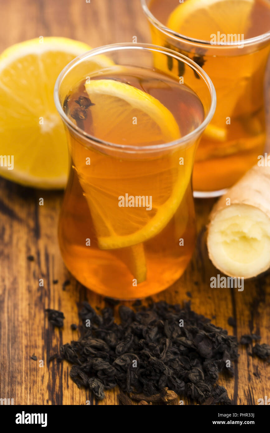 Black tea with lemon and ginger Stock Photo - Alamy