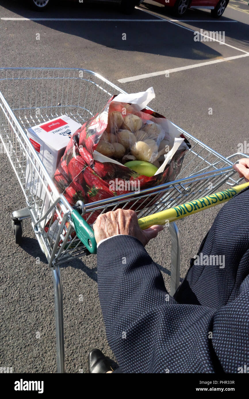 Elderly lady supermarket shopping at Morrisons, Halfway, Sheffield ...