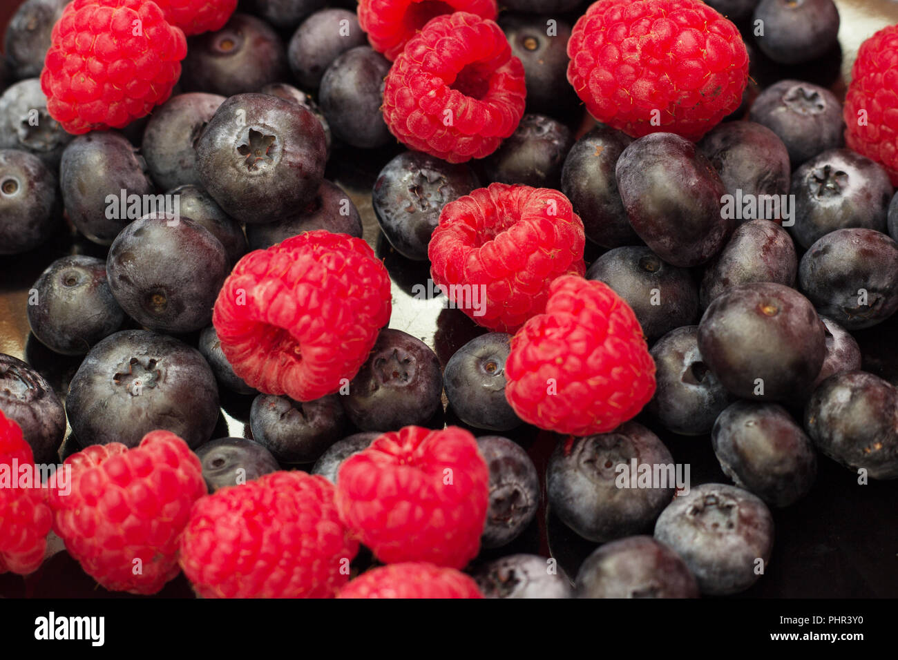 Mix of blueberries and raspberries Stock Photo - Alamy