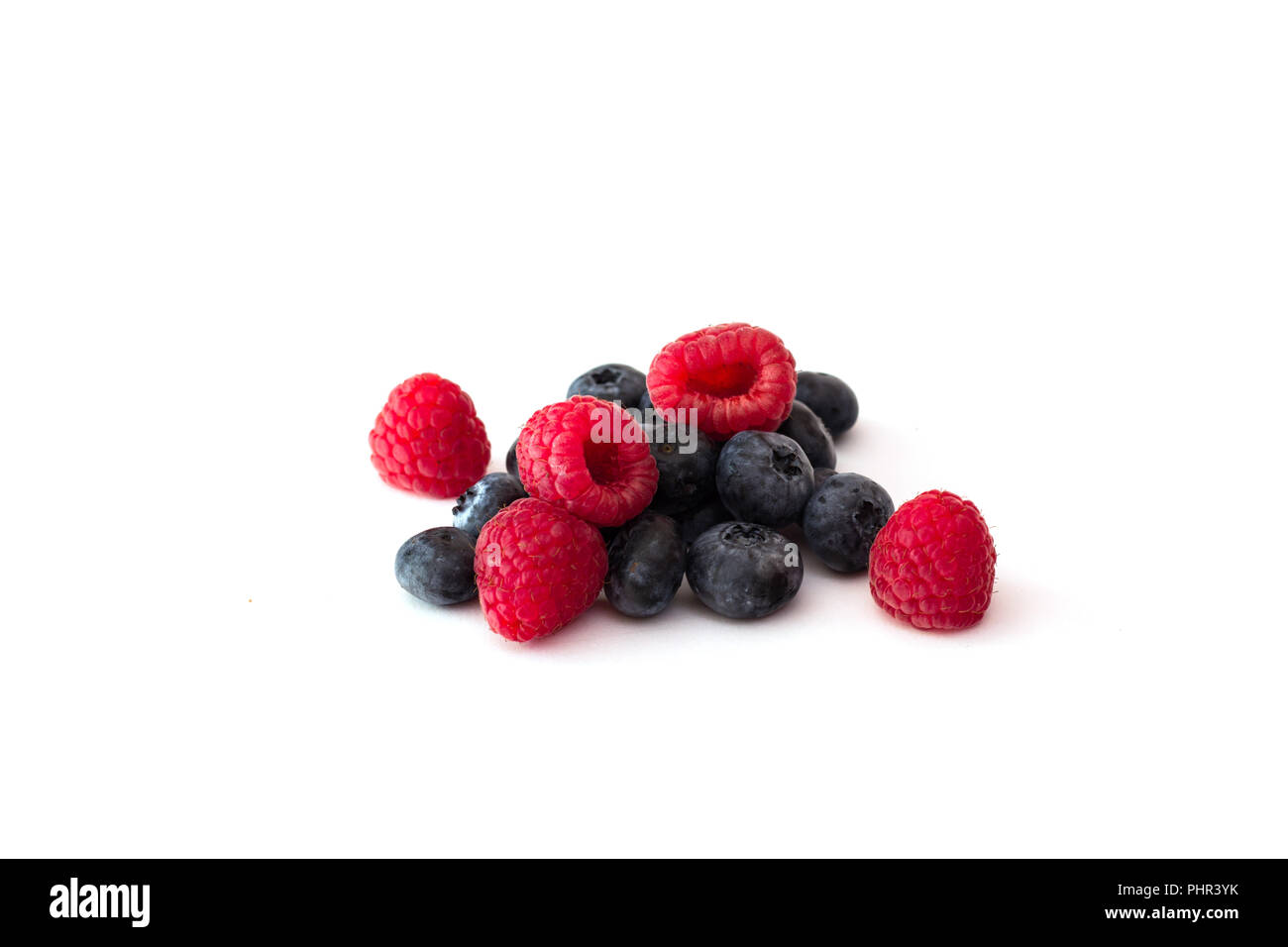 Blueberries and raspberries on white background Stock Photo - Alamy
