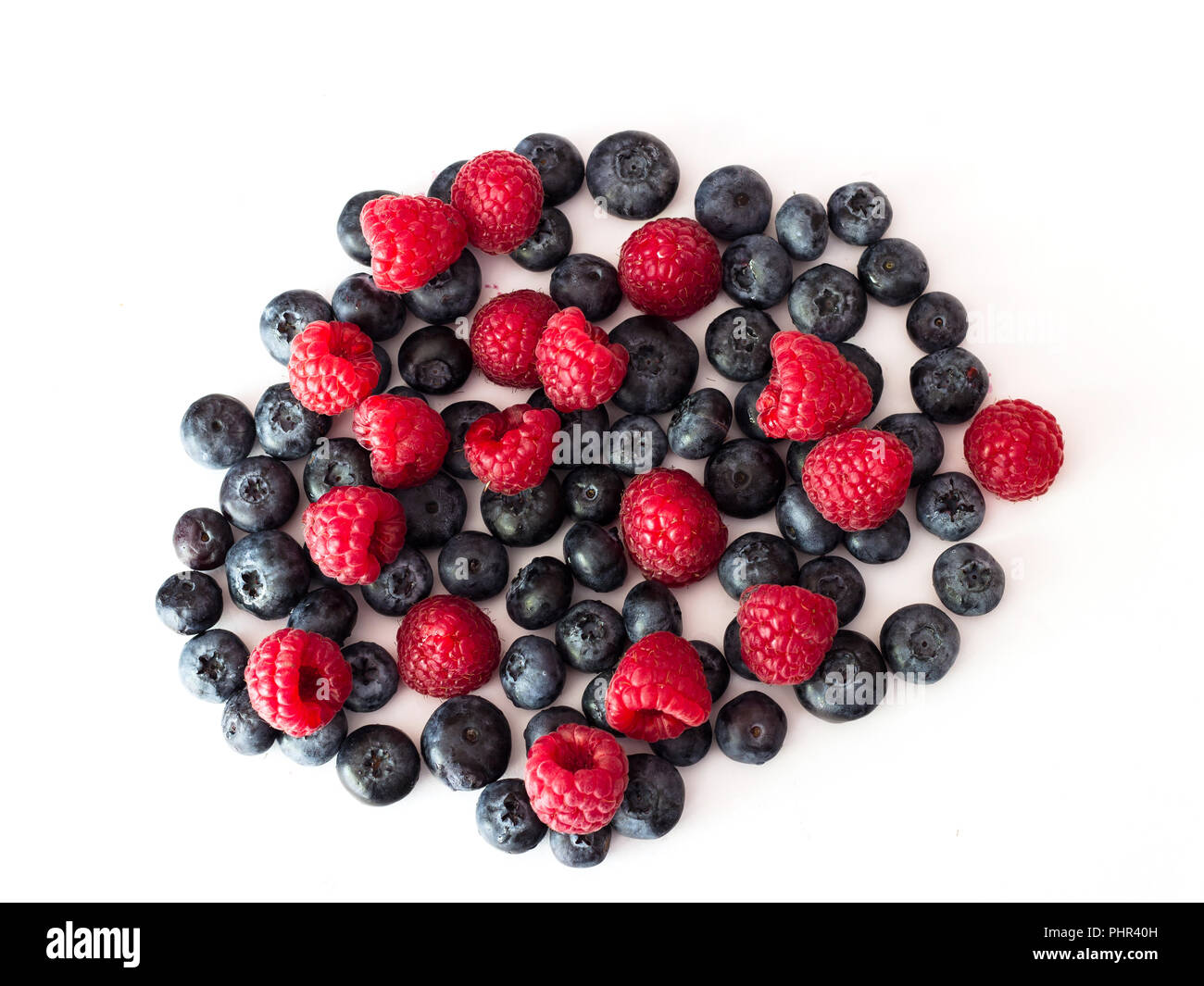 Blueberries and raspberries on white background Stock Photo - Alamy