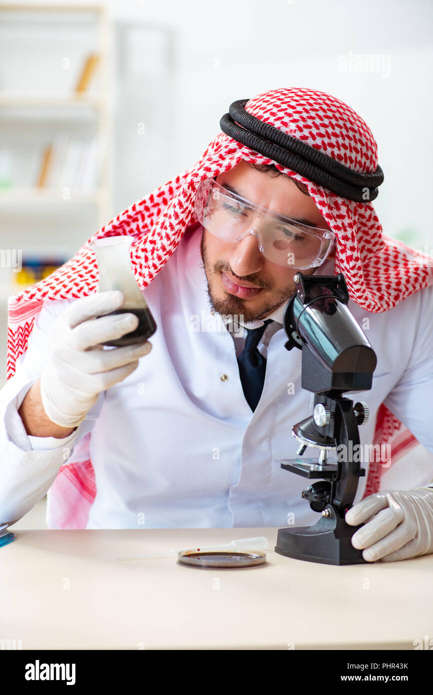 Arab chemist scientist testing quality of oil petrol Stock Photo - Alamy