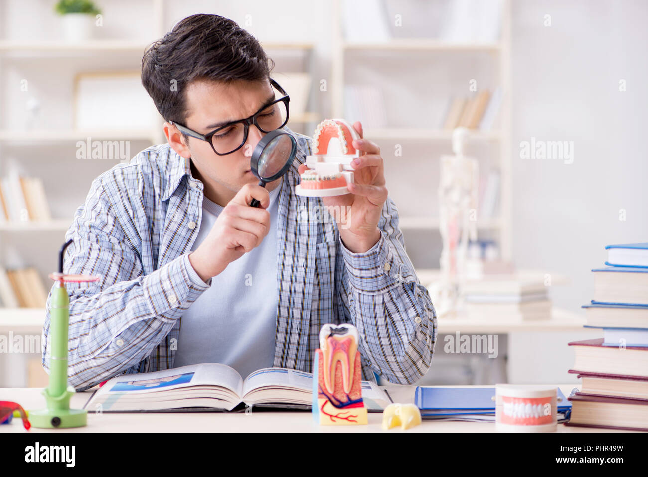 Medical student learning dentistry in classroom Stock Photo - Alamy