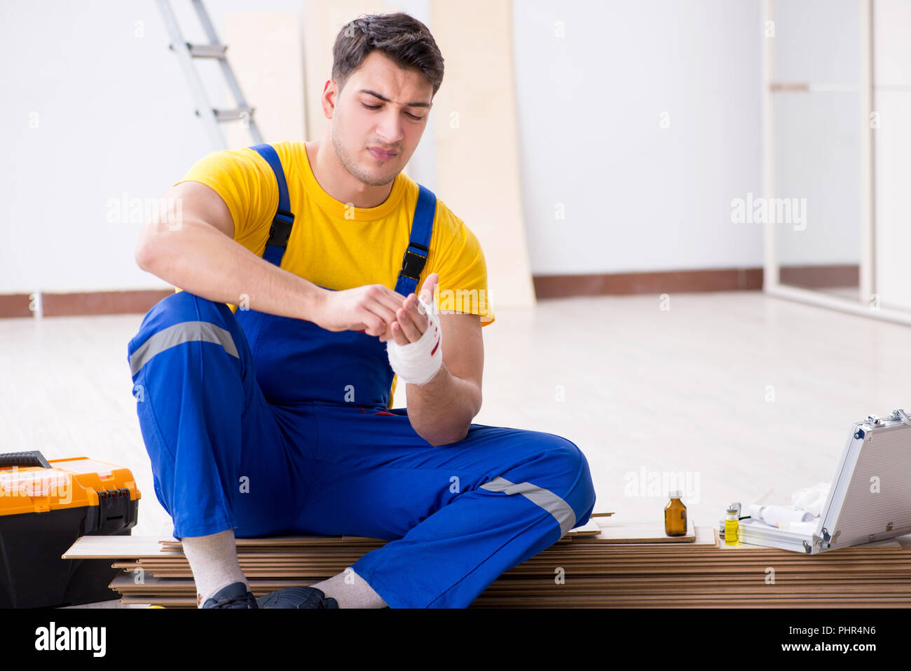 Worker with injured hand at construction site Stock Photo - Alamy