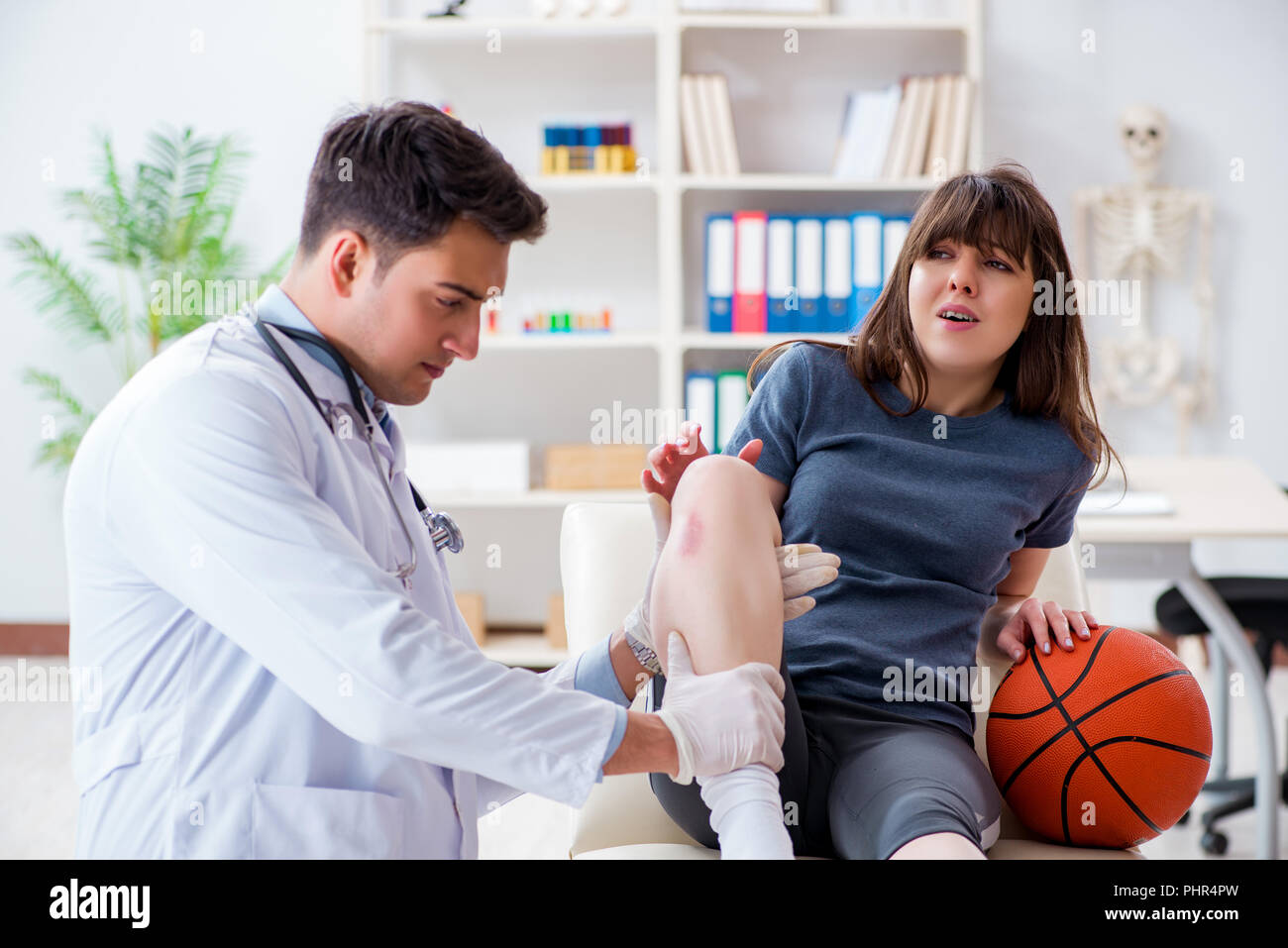 Female basketball player visiting doctor after injury Stock Photo - Alamy