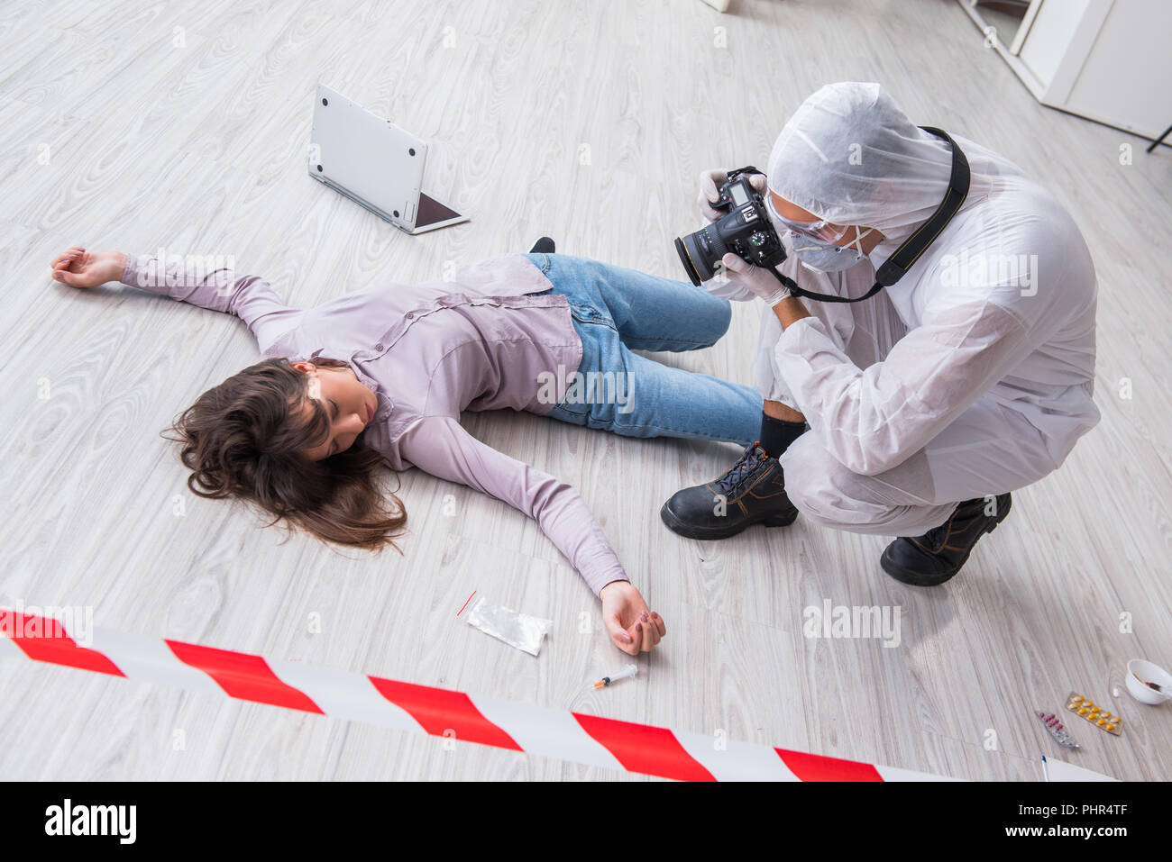 Forensic Investigator At The Crime Scene Investigating Woman Mur Stock