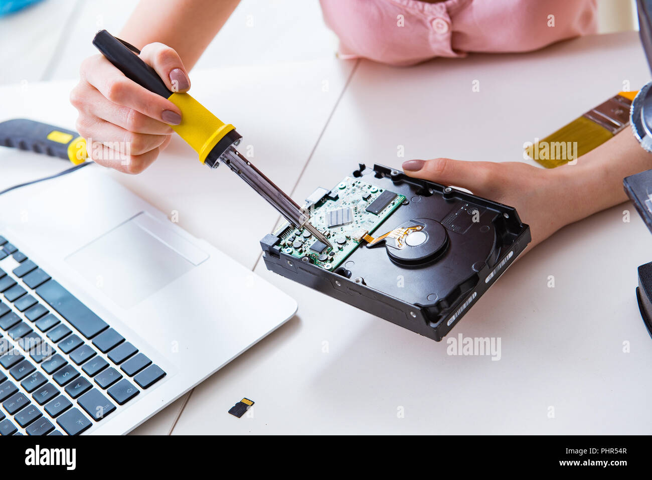 Hard drive repair and data recovery with restoration Stock Photo - Alamy