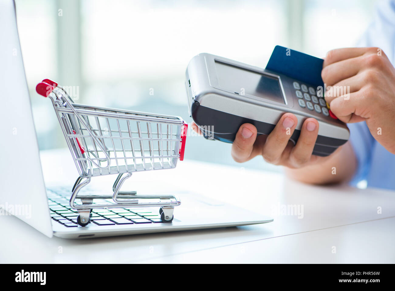 Paying for online purchase with credit at POS Stock Photo - Alamy