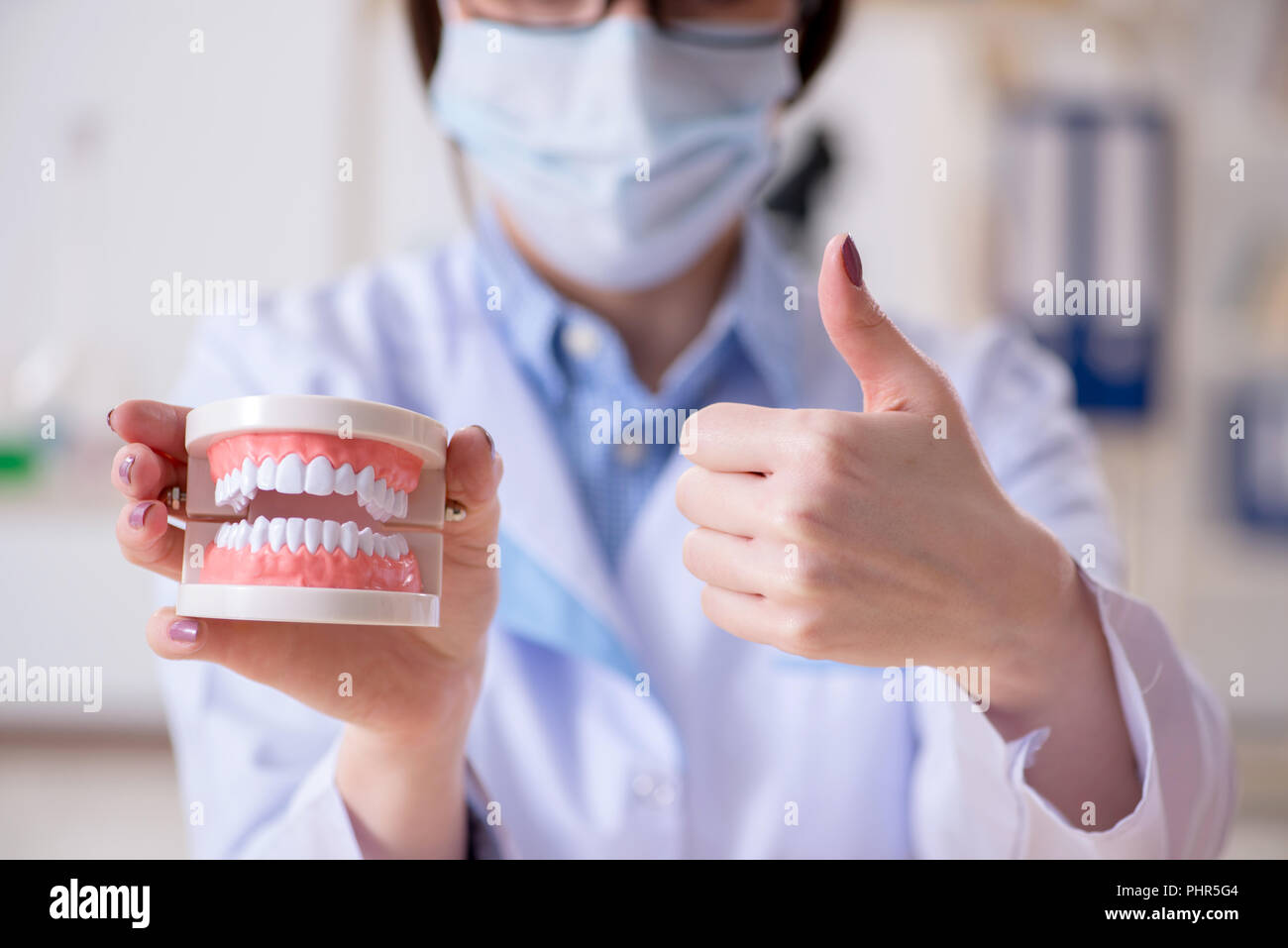 Dentist practicing work on tooth model Stock Photo - Alamy