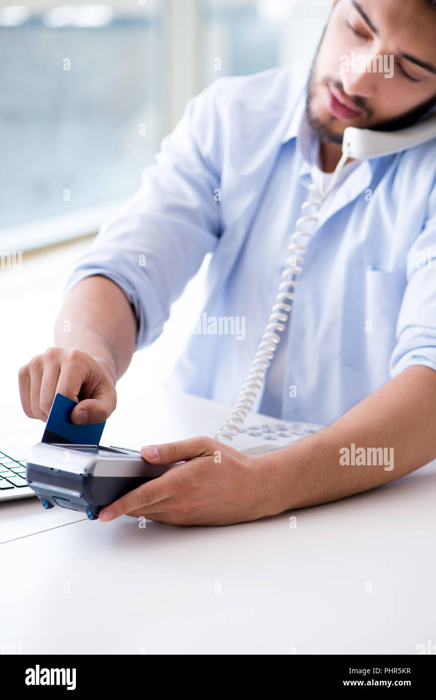 Man processing credit card transaction with POS terminal Stock Photo ...