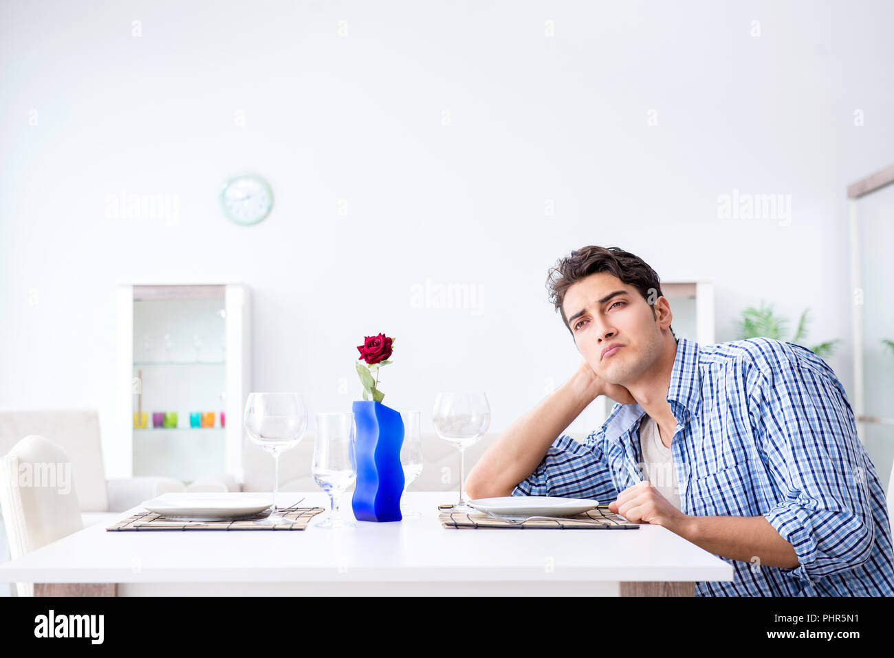Man alone preparing for romantic date with his sweetheart Stock Photo ...