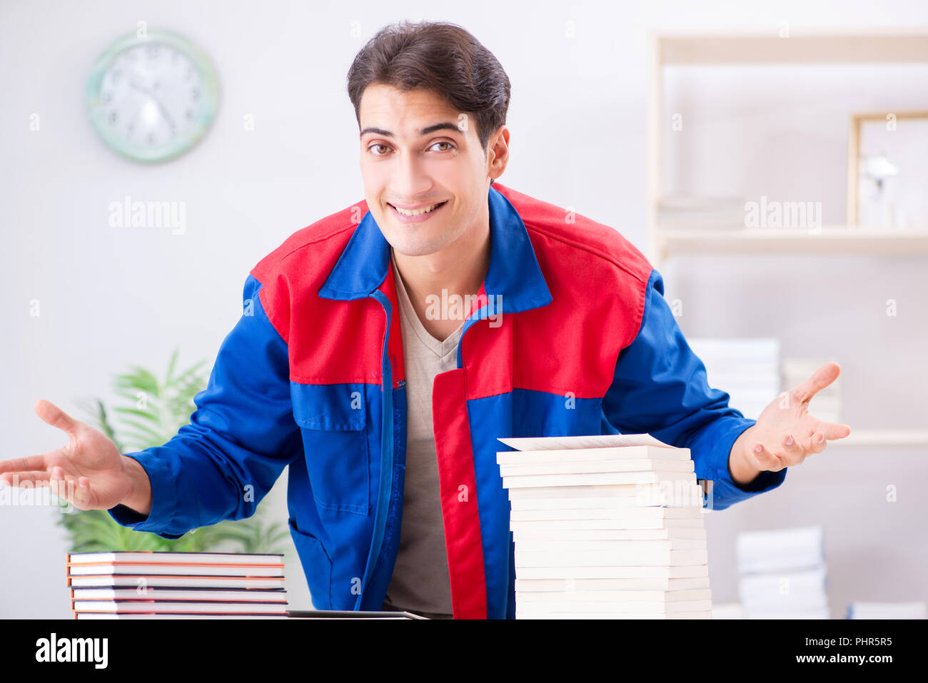 Worker in publishing house preparing book order Stock Photo - Alamy