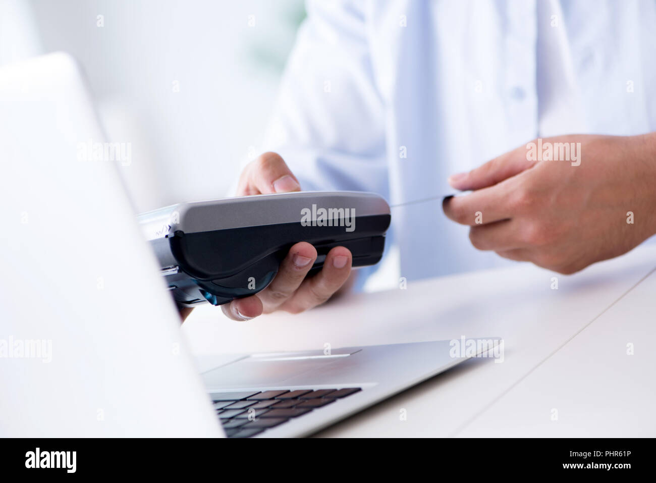 Man processing credit card transaction with POS terminal Stock Photo ...