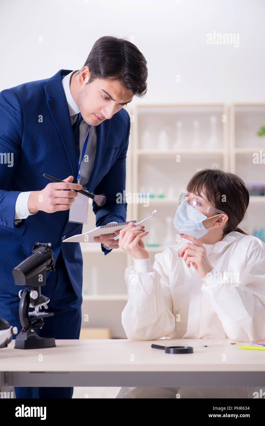 Expert criminologist working in the lab for evidence Stock Photo - Alamy