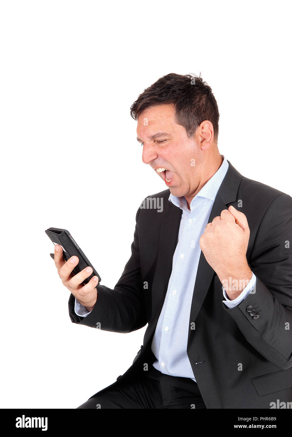 Business man screaming at his cellphone Stock Photo - Alamy