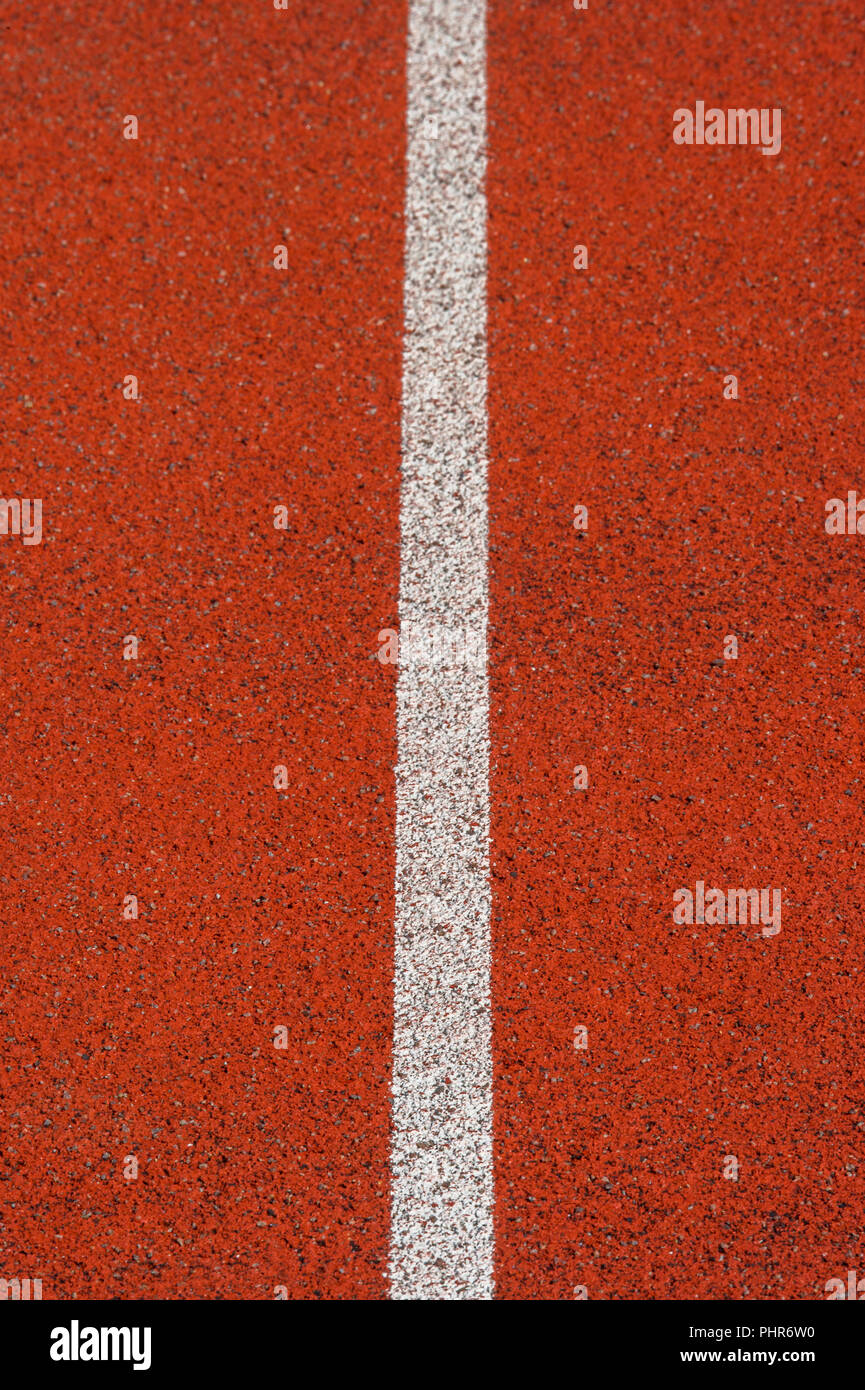 running track rubber standard red color and white line Stock Photo - Alamy