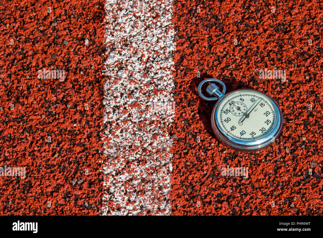 old sport stopwatch on running track rubber Stock Photo - Alamy