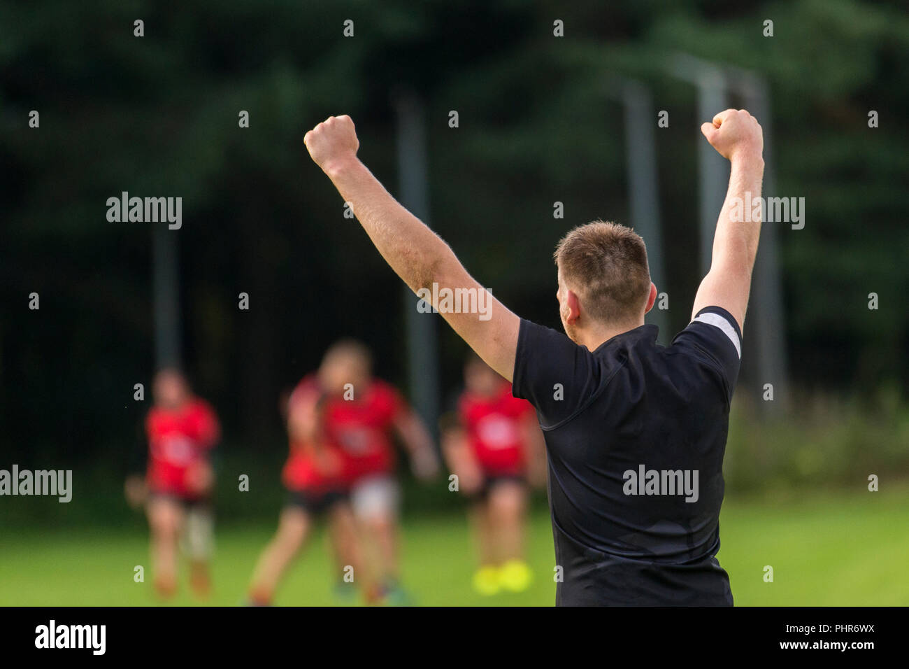 rugby player celebrating a goal on a rugby field Stock Photo - Alamy