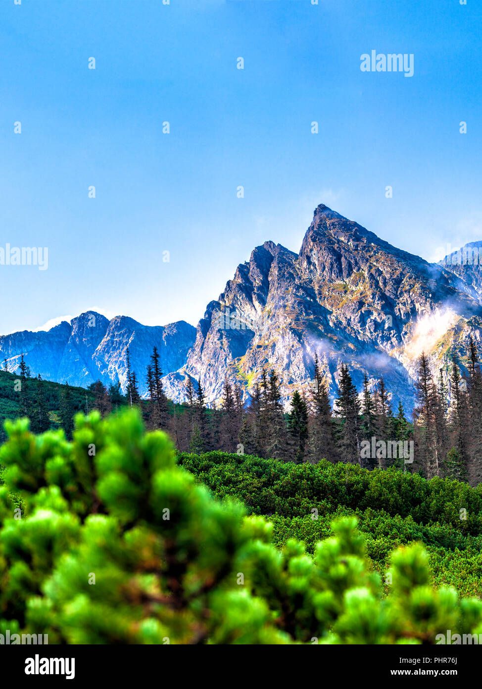 Polish Tatra mountains summer landscape with blue sky and white clouds ...