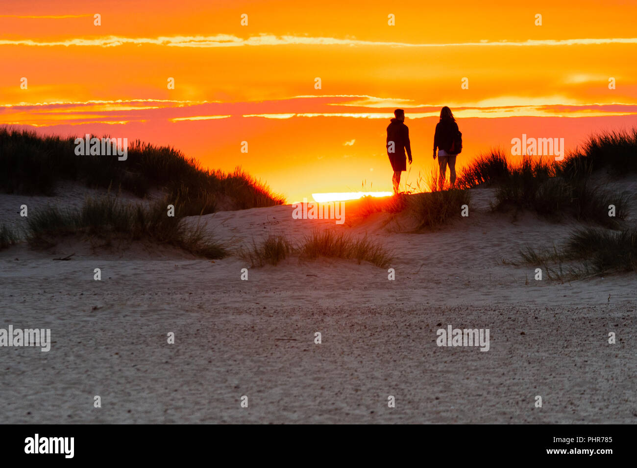 Adult watching sunset hi-res stock photography and images - Alamy