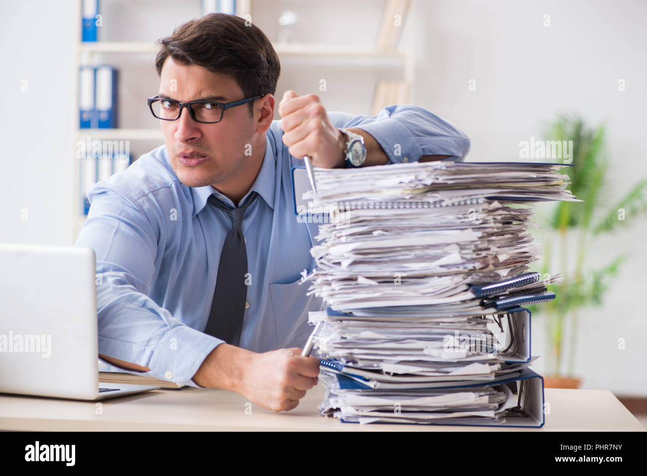 Extremely busy businessman working in office Stock Photo - Alamy