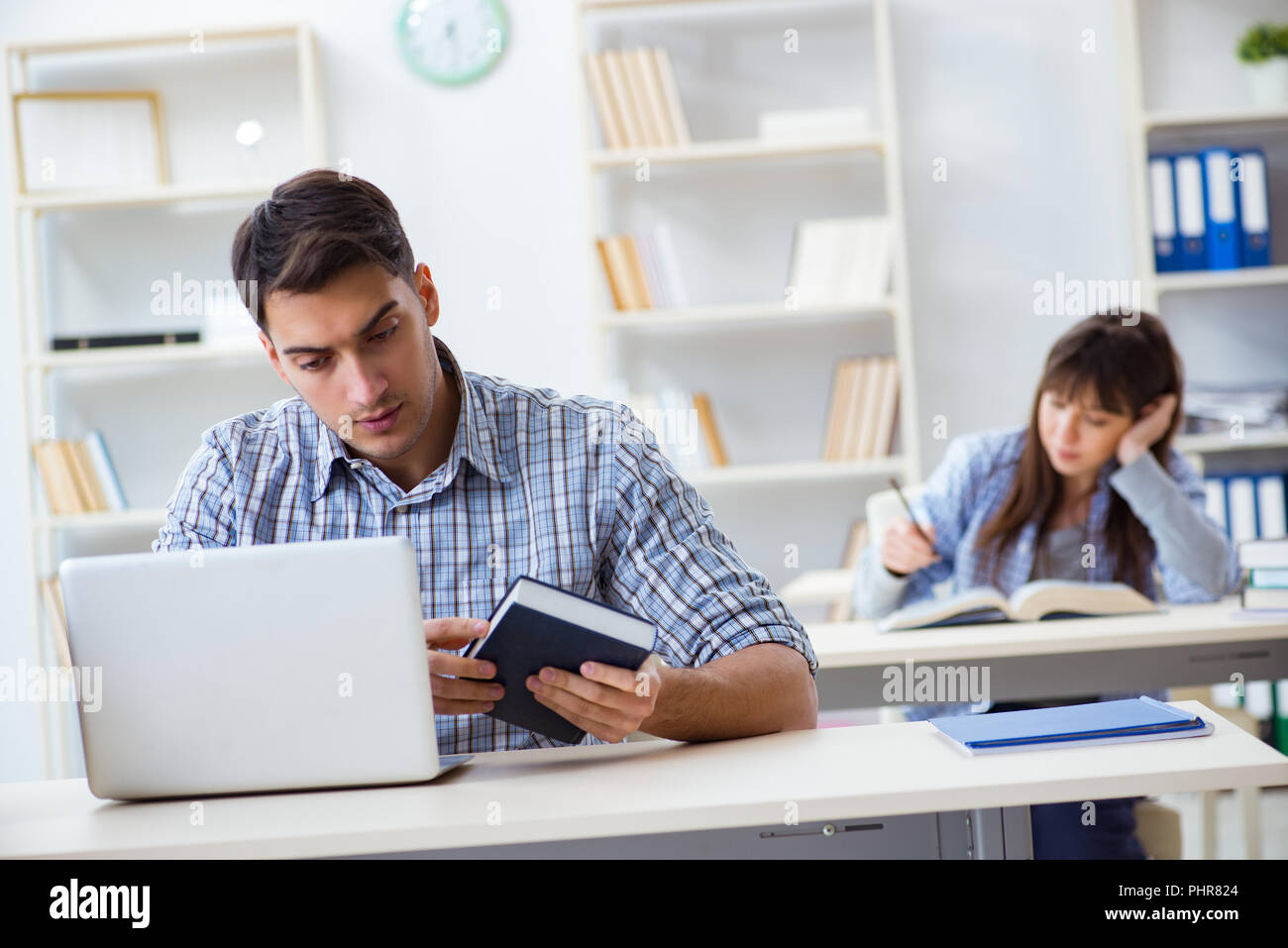 Students sitting and studying in classroom college Stock Photo - Alamy
