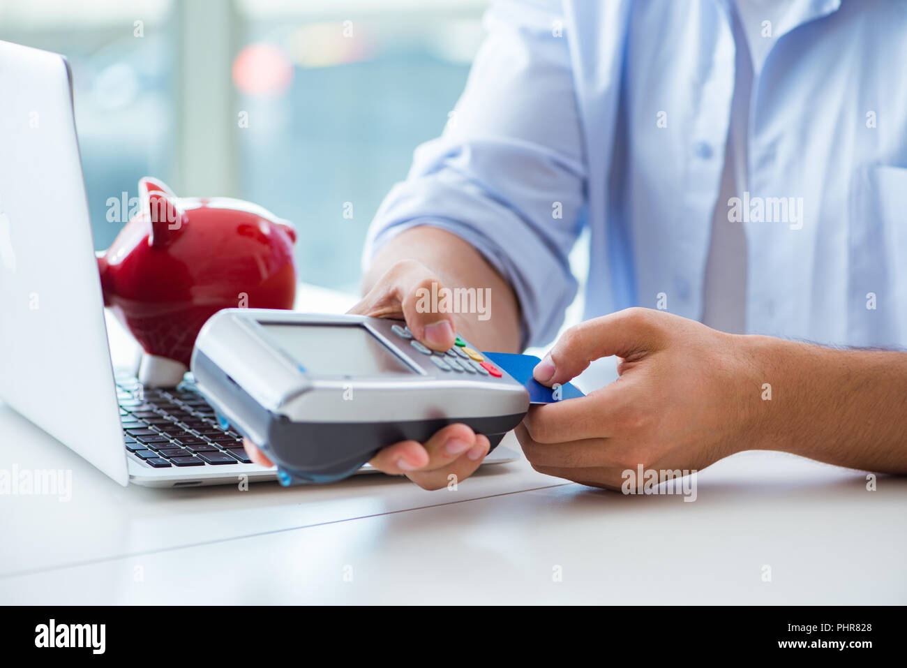 Man processing credit card transaction with POS terminal Stock Photo ...