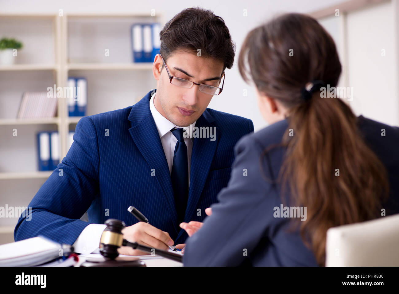 Lawyer talking to his client in office Stock Photo - Alamy