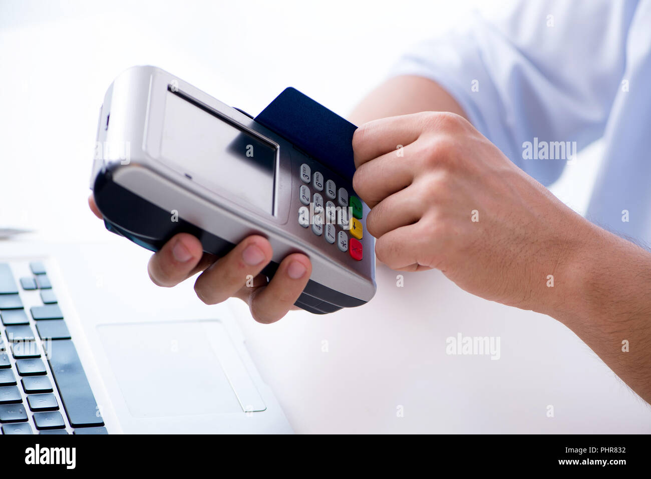 Man processing credit card transaction with POS terminal Stock Photo ...